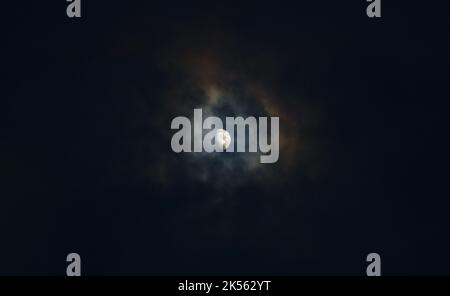 full moon cover by spreading cloud in night Stock Photo - Alamy