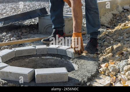 Utility worker construction pit for a septic tank the sewerage manhole ...