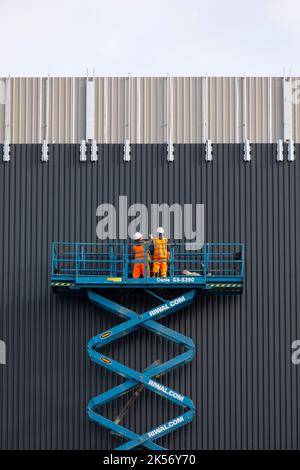 Worked installing cladding on industrial building using scissor lift ...