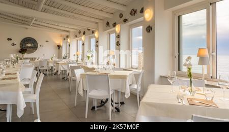 Interior of an elegant Italian restaurant with sea view Stock Photo - Alamy