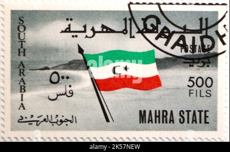 Photo of a postage stamp from the Mahra State of Qishn and Socotra Flag ...