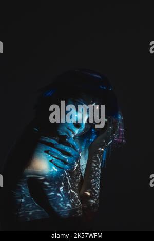 art portrait night melancholy blue woman face dark Stock Photo - Alamy