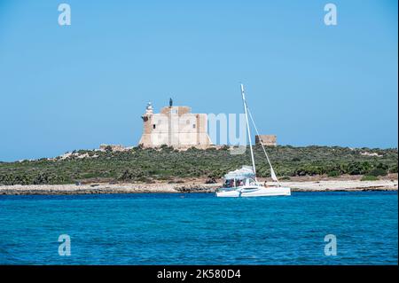 The island of Capo Passero in front of Portopalo where the waters of ...