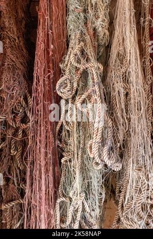Fishing equipment. Closeup of old net. White fishnet on shore outdoor ...