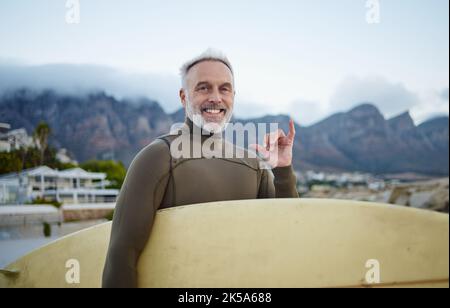 Shaka, surf and sports with the hand sign of a man on the beach for ...