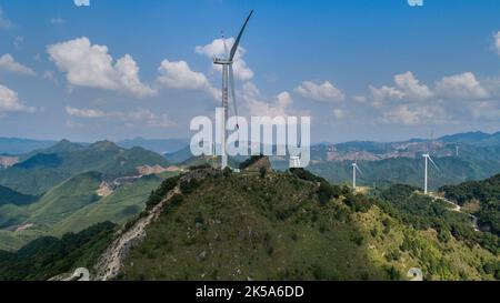 NANNING, CHINA - OCTOBER 6, 2022 - 25 wind turbines form a windmill ...