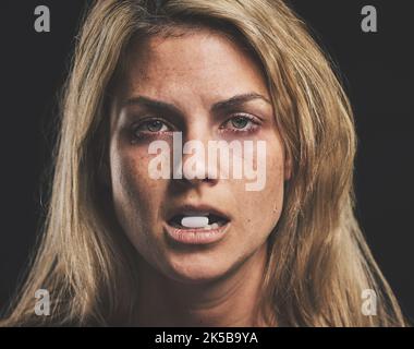 Female model in pain suffering from headache over greenscreen backdrop ...