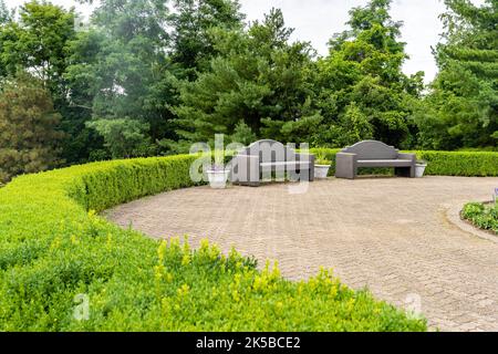 A closeup shot of grey benches in the garden on a sunny day Stock Photo ...