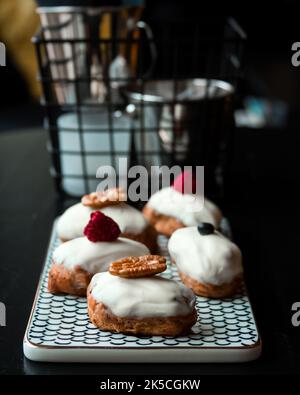 Traditional french eclairs with chocolate. Breakfast in the cafe ...