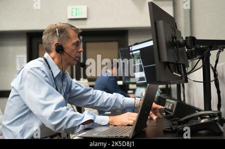 Zeb Scoville, NASA's chief flight director, monitors the launch of a ...