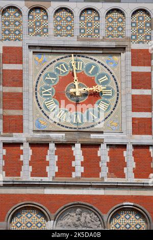Clock on the facade, Amsterdam Centraal, Central Station, Amsterdam ...