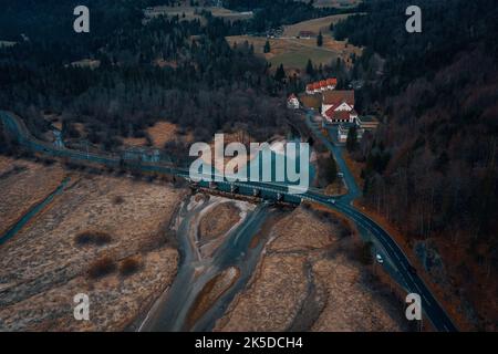 An aerial shot of the Wiestalstausee reservoir in Salzburg, Austria ...
