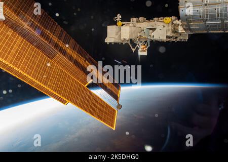 Solar arrays from the International space station floating above earth ...