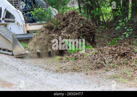 Using bulldozer for landscaping works, scoop to move earth around Stock ...