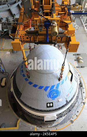 The CST-100 Starliner was lifted at the Vertical Integration Facility ...
