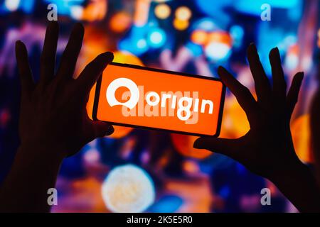 In this photo illustration, the Origin Energy logo is displayed on a ...