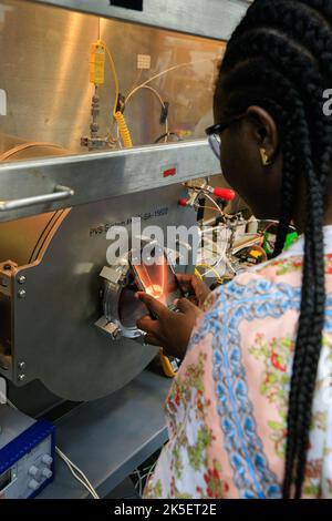 An engineer conducts testing of the Molten Regolith Electrolysis (MRE ...