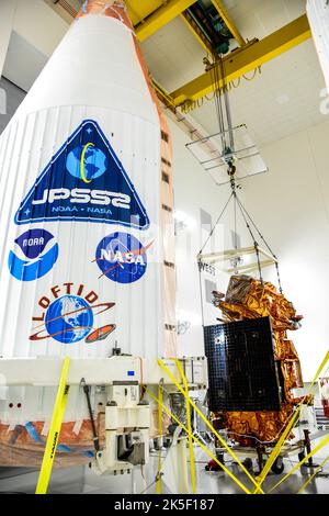 A crane is used to transfer NASA and the National Oceanic and ...