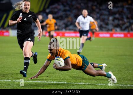 Australia's Ivania Wong dives over in the corner to score the opening ...