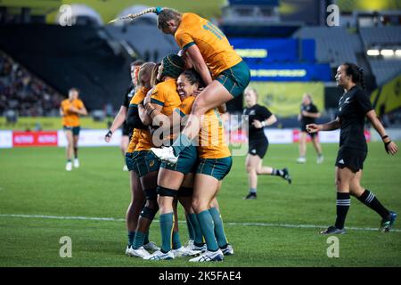 Australia's Ivania Wong celebrates with team mates after scoring a try ...