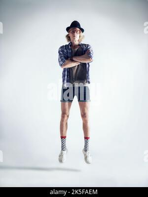 Young man floating above the ground in the countryside Stock Photo - Alamy