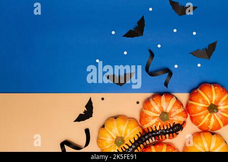 Halloween symbol concept, Centipede on scary smile pumpkins with bats ...