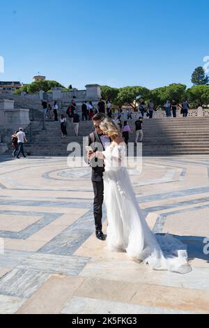 A couple in wedding clothes at The Victor Emmanuel II Monument, (Altare ...