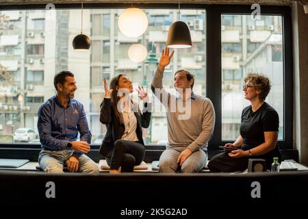 Four amazing business people are discussing the plans and ideas Stock ...