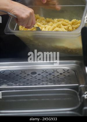 Pasta boiler in professional kitchen of restaurant Stock Photo - Alamy