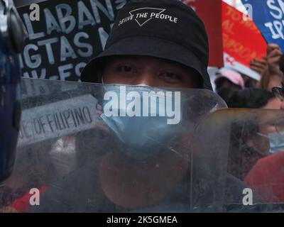 Protesters wearing a President Marcos Jr., former President Rodrigo ...