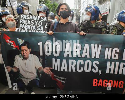 Protesters wearing a President Marcos Jr., former President Rodrigo ...