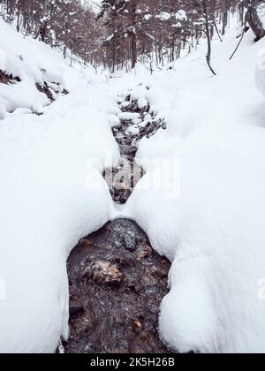 Minimalist abstract picture of a mountain stream flowing beneath the ...