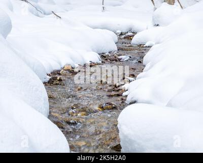 Minimalist abstract picture of a mountain stream flowing beneath the ...