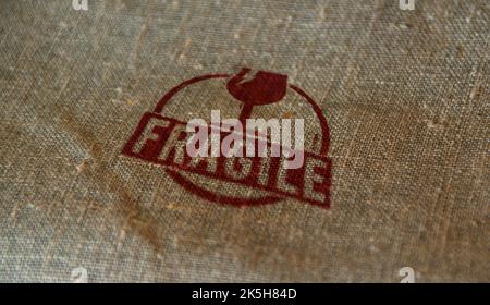 Fragile stamp printed on linen sack. Careful shipping and handle with ...