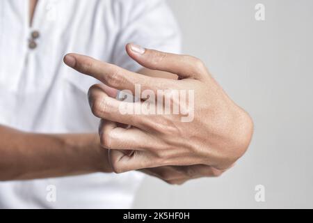Fingers rigidity, Hand muscles spasm, or Weakness of digits. Closeup ...