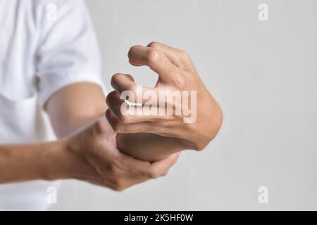 Fingers rigidity, Hand muscles spasm, or Weakness of digits. Closeup ...