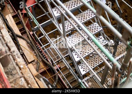 Construction site basement excavation with temporary propping, concrete ...