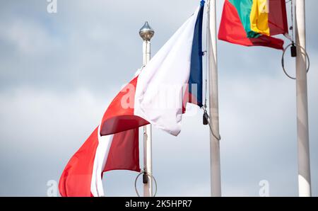 European flags are hoisted on masts and fluttering in the wind ...