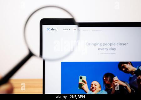 The logo of Meta on a laptop desktop under a magnifying glass Stock ...