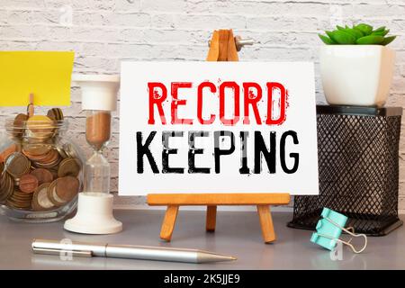 text record keeping on white paper card, lens on blue background Stock ...