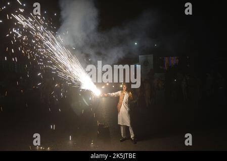 Pakistani people light fireworks on the eve of the Muslim festival of ...