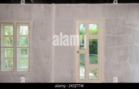 Water-based paint repair concept. yellow paint on artificial grass ...