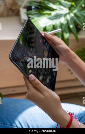 Young man watching stock market on laptop Stock Photo - Alamy