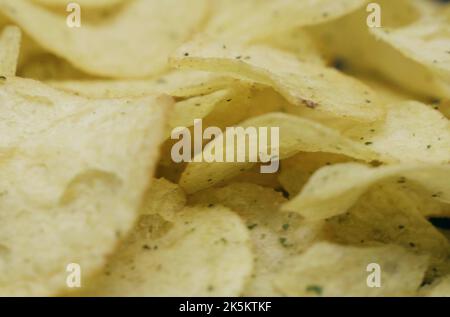 Potato chips on a rotating surface. Close-up. Food Stock Photo - Alamy