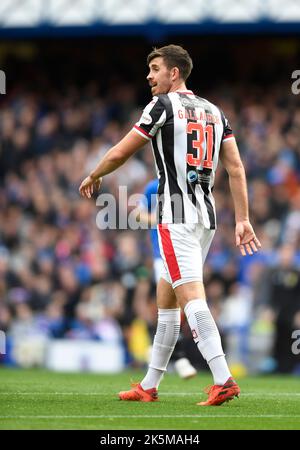 Glasgow, , 8th October 2022. Declan Gallagher of St Mirren brings down ...