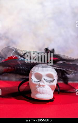 Cheerful Human skull with eyelashes on a red background Stock Photo - Alamy