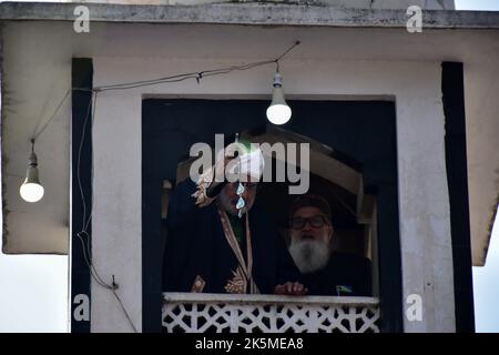 A head priest of the Hazratbal Shrine displays the holy relic believed ...
