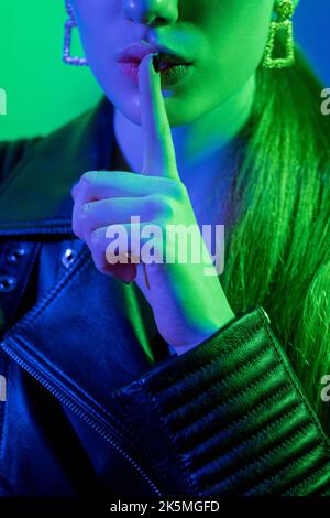 Shush gesture. Neon light banner. Female secret. Sci-fi mystery. Green ...
