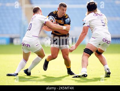 Ryan Mills of Wasps Rugby is tackled by Matt Proctor of Northampton ...