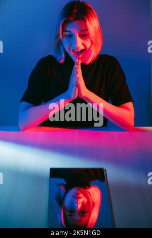 bipolar disorder upset woman in pink blue light Stock Photo - Alamy